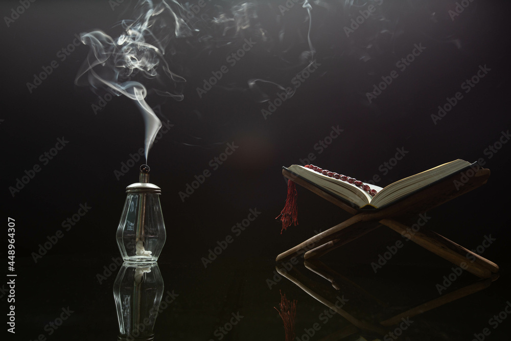 Quran in the mosque - open for prayers The black background of the ...