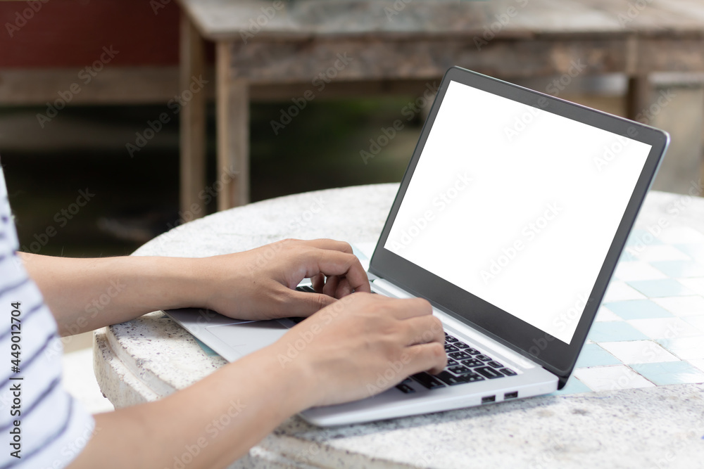 Man's using or typing with laptop computer on desk. Laptop computer ...