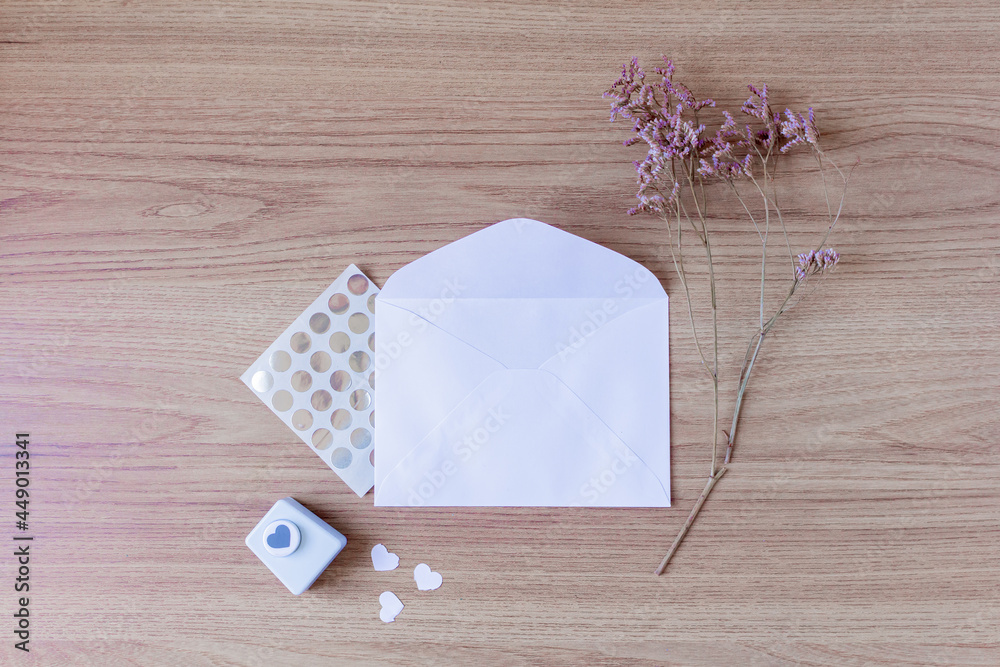 Envelope on wooden table. Home office desk workspace with notebook and ...