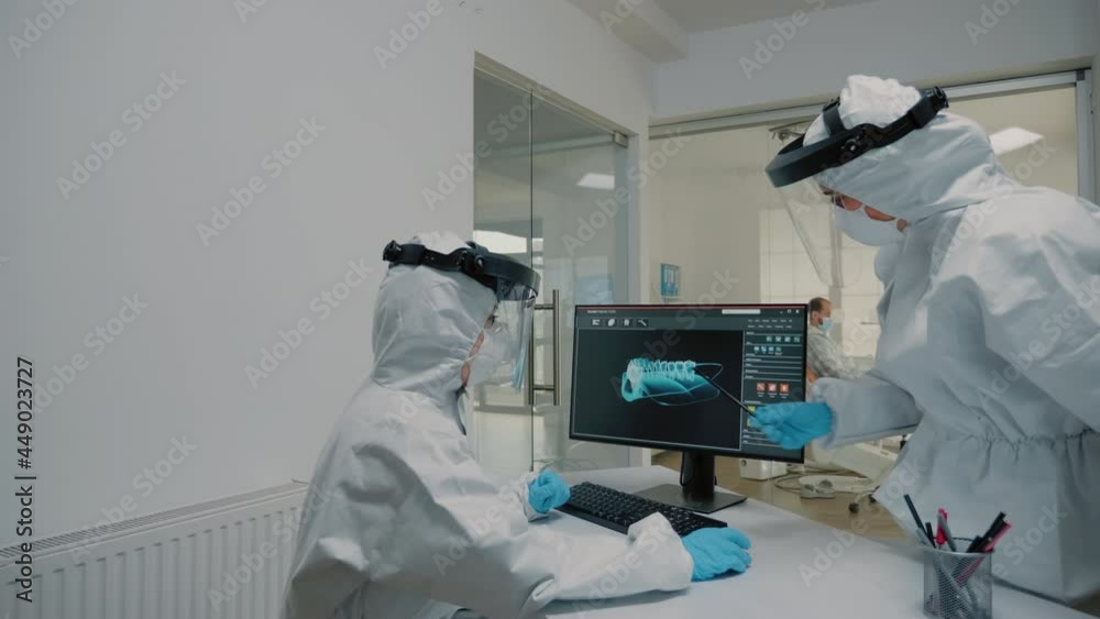 Vidéo Stock Professional stomatology team analyzing teeth x ray on ...