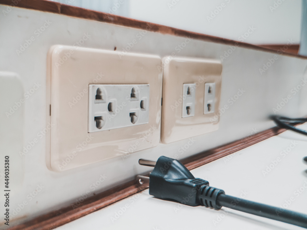 Electrical appliance being unplugged to save power and reduce ...