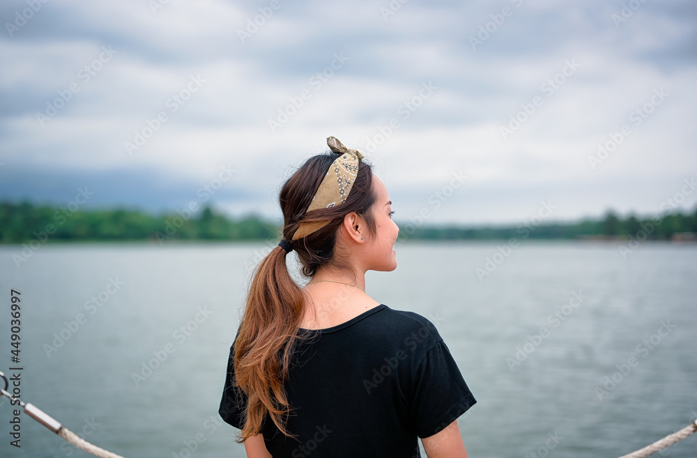 Back view point of young women standing and looking at far away ...