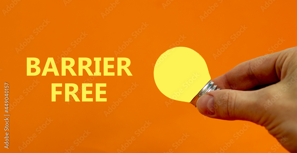 Barrier free symbol. Businessman holds yellow shining light bulb. Words ...