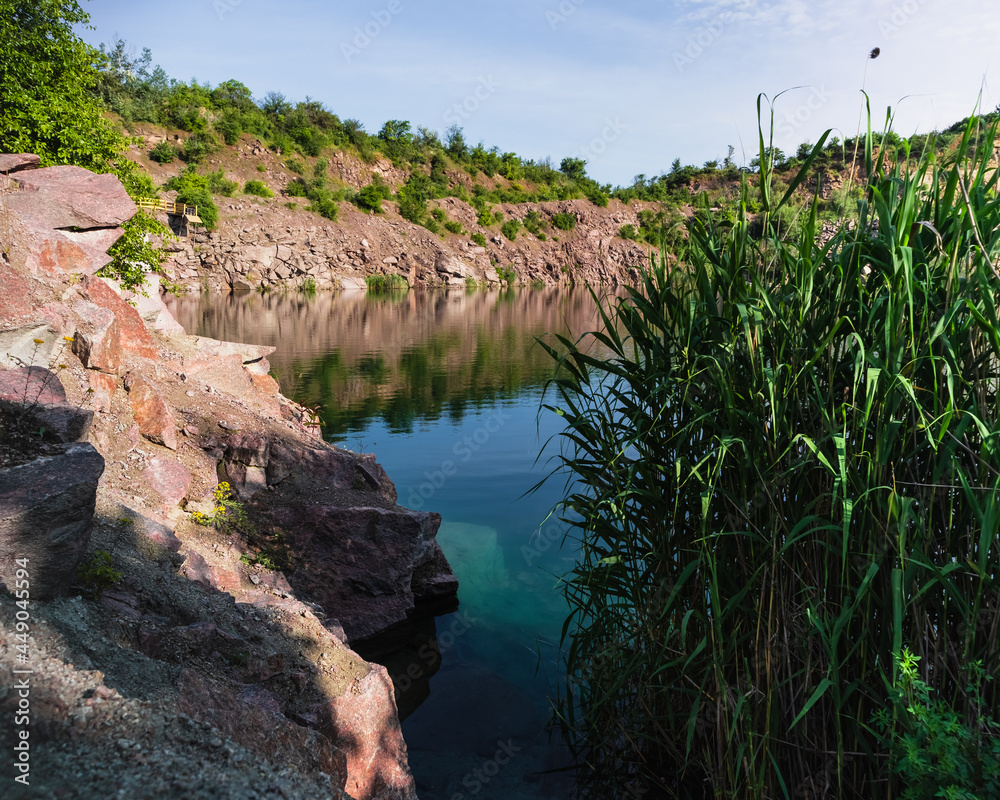 The granite shore of Radon Lake on a clear summer day. A great place to ...