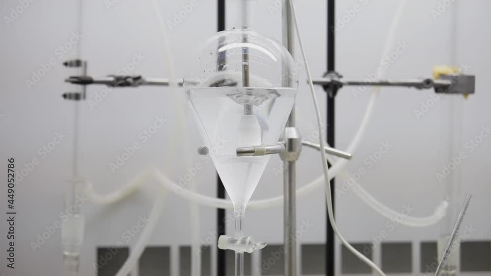 Video Stock A large flask of liquid in a chemical laboratory. The ...