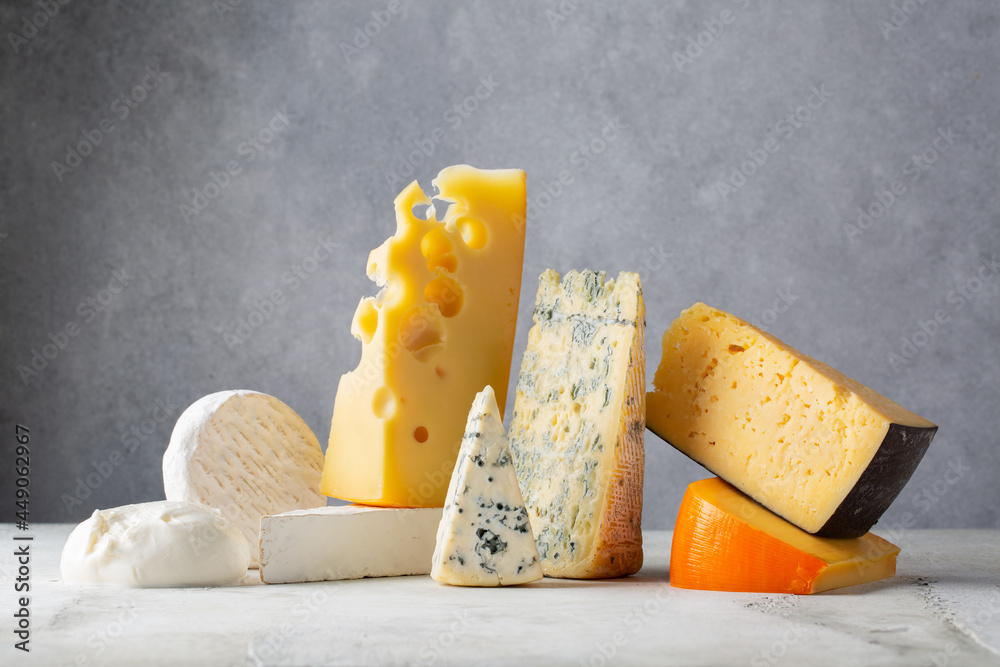 Different types of cheese. Cheeses mix maasdam, burrata, cheddar, dor ...