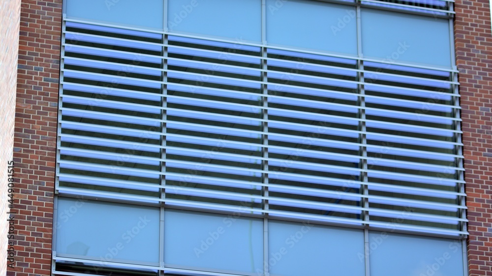 Futuristic facade of a modern office building clad in glass. Glass ...