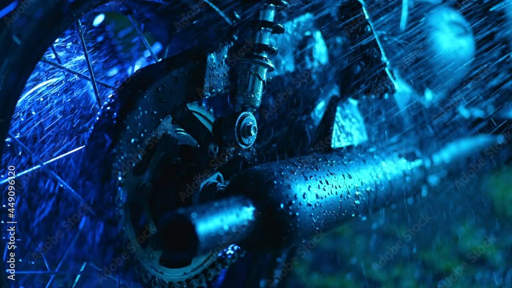 Washing with water rear wheel, exhaust pipe and chain of classic black ...