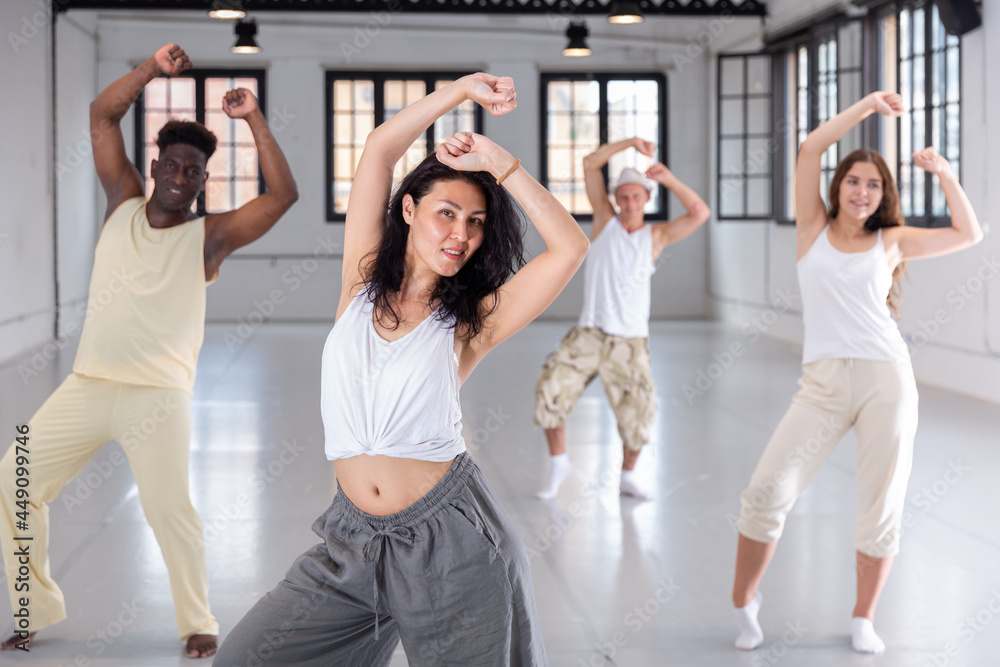 Confident asian female dancer enjoying dancing break dance with her ...