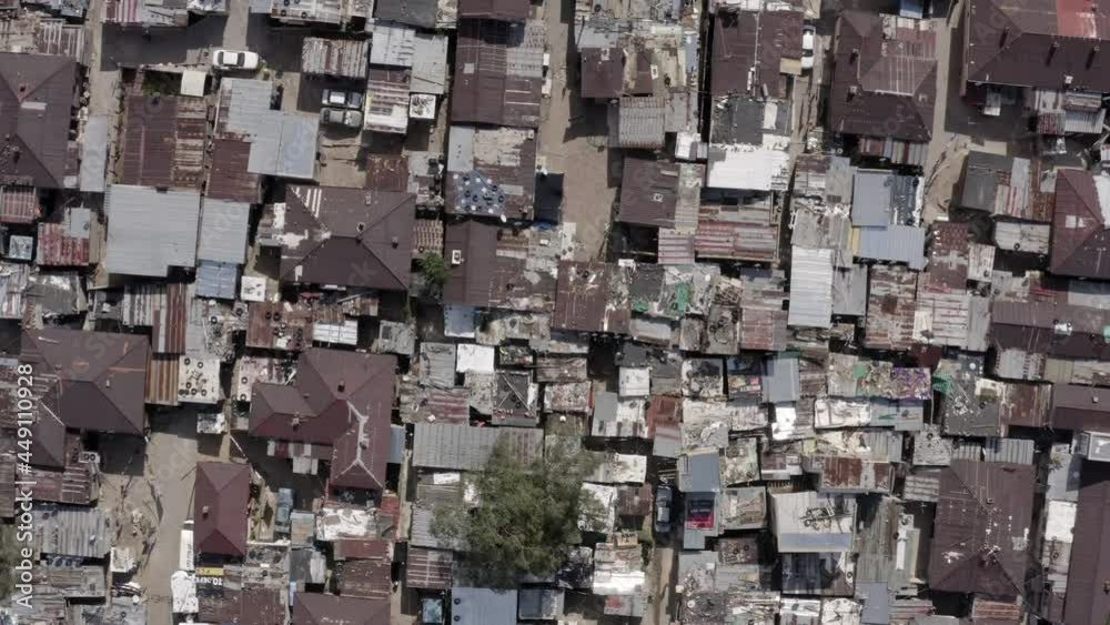 Slow Arial shot looking down at Alexandra, a township in Johannesburg ...