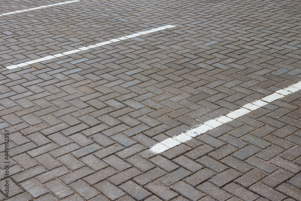 parking lot markings on paving slabs Stock Photo | Adobe Stock