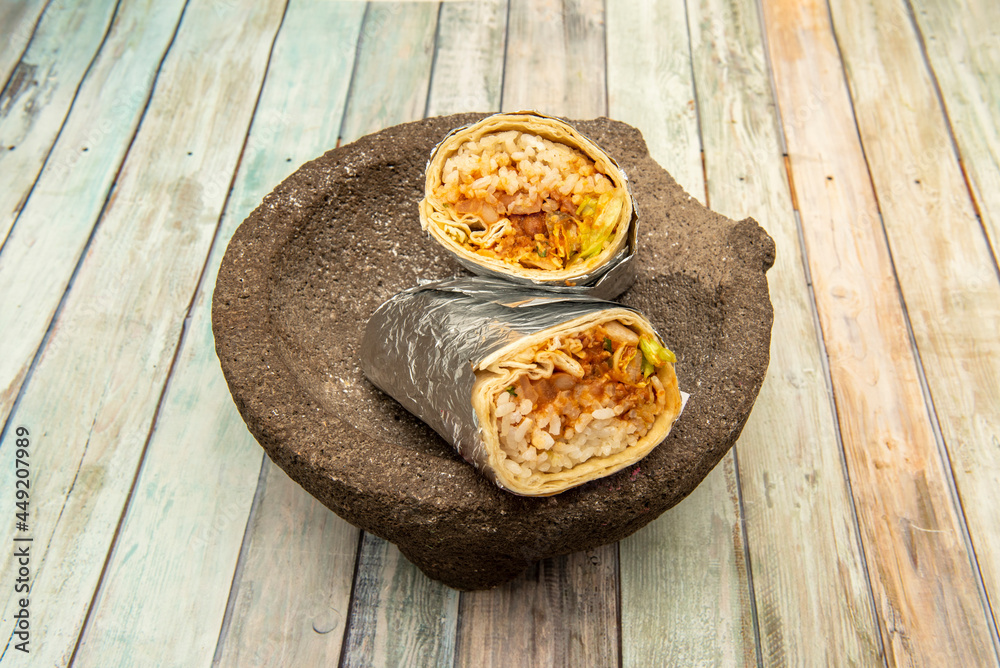 Huge and delicious Mexican chili con carne burrito dipping the rice and ...