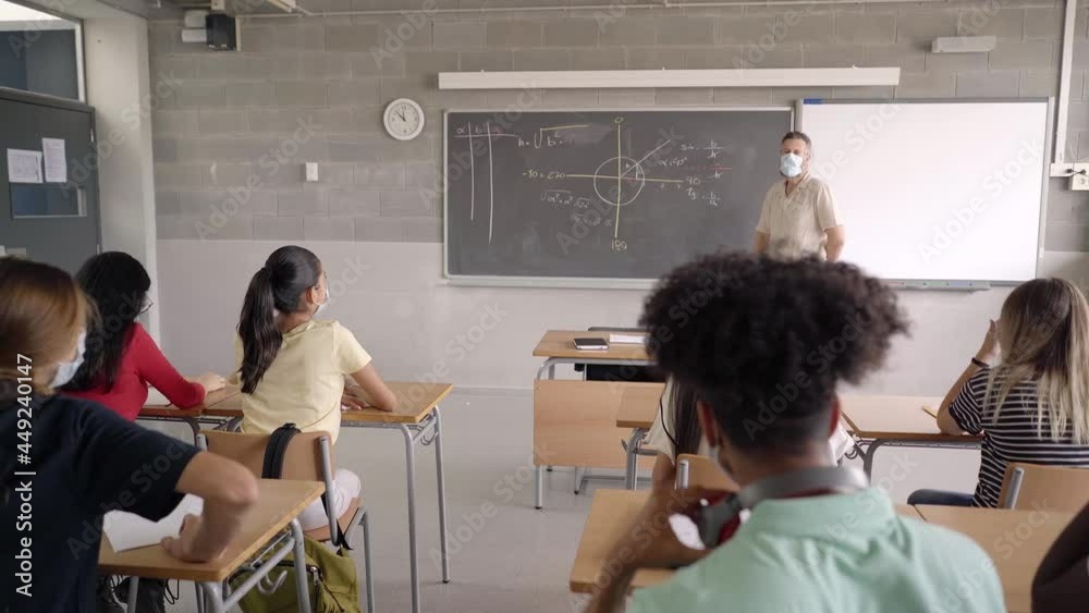 At back to school, the teacher and students wear protective masks due ...