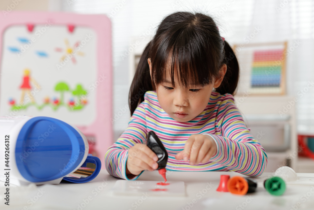 young girl making 3D shape craft for homeschooling Stock Photo | Adobe ...