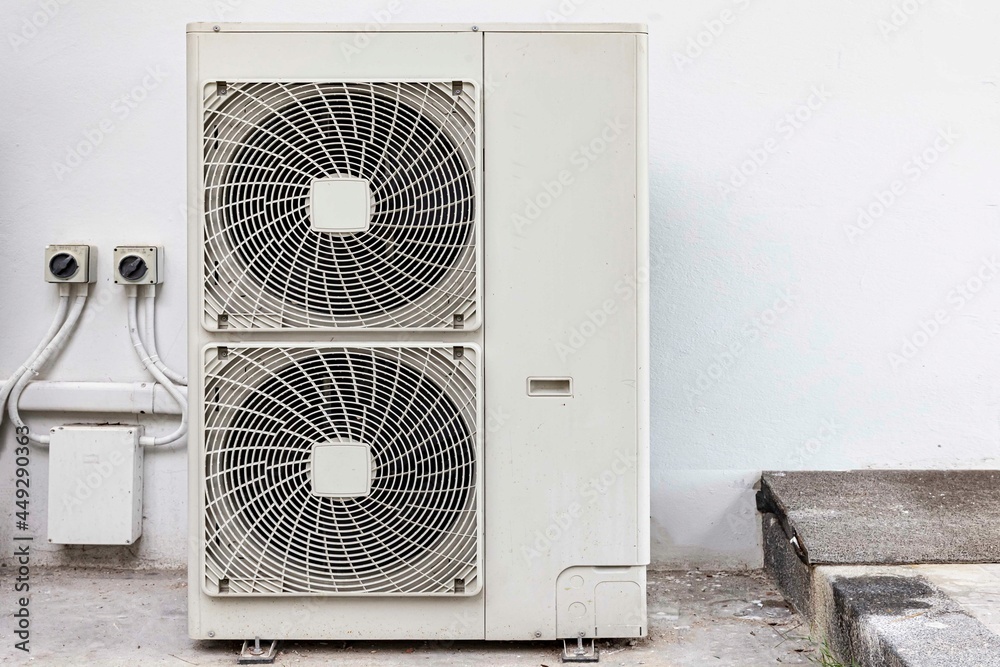 Air conditioner compressor outdoor unit installed outside the building ...