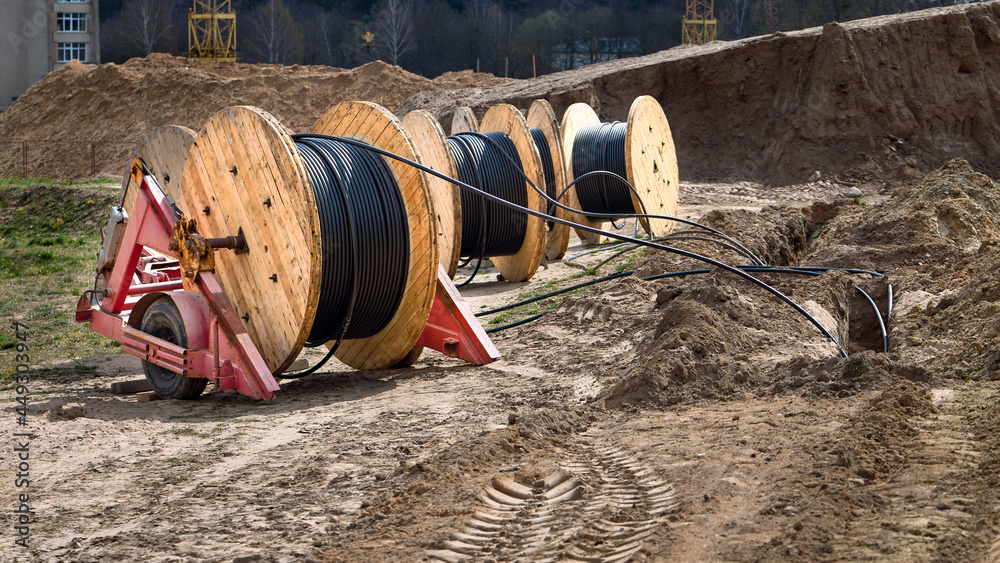 Cable high voltage electric in roll or round coil on ground. Concept of ...