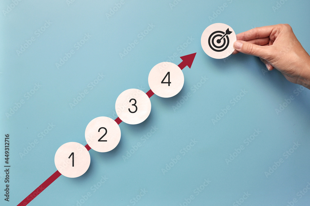 Paper circles with numbers and a target icon above them. A symbol of a ...