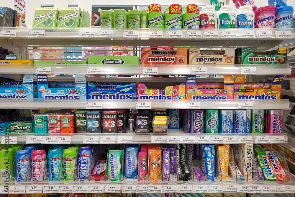 Various choices of candies and chewing gum on the store shelf in ...