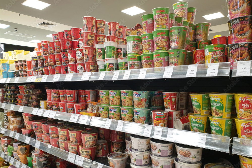 Various choices of instant cup noodles on store shelf in Aeon grocery ...