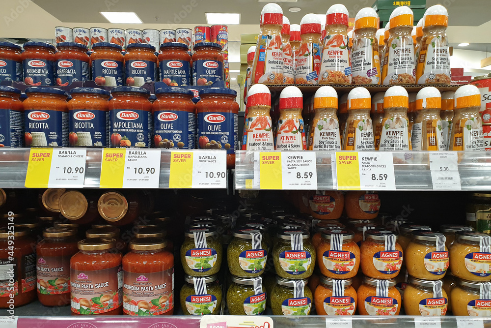 Various choices of pasta sauce on store shelves in Aeon grocery store ...