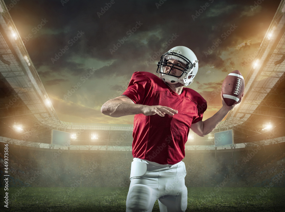 American football sportsman player with ball in action on stadium under ...