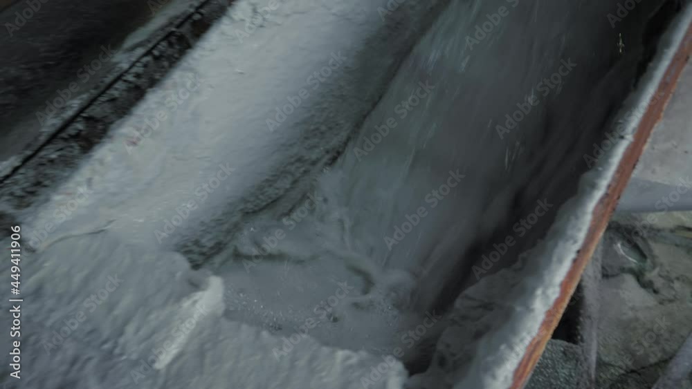 Manufacturing of Asbestos Card Board. Liquid Substance is moving Along ...