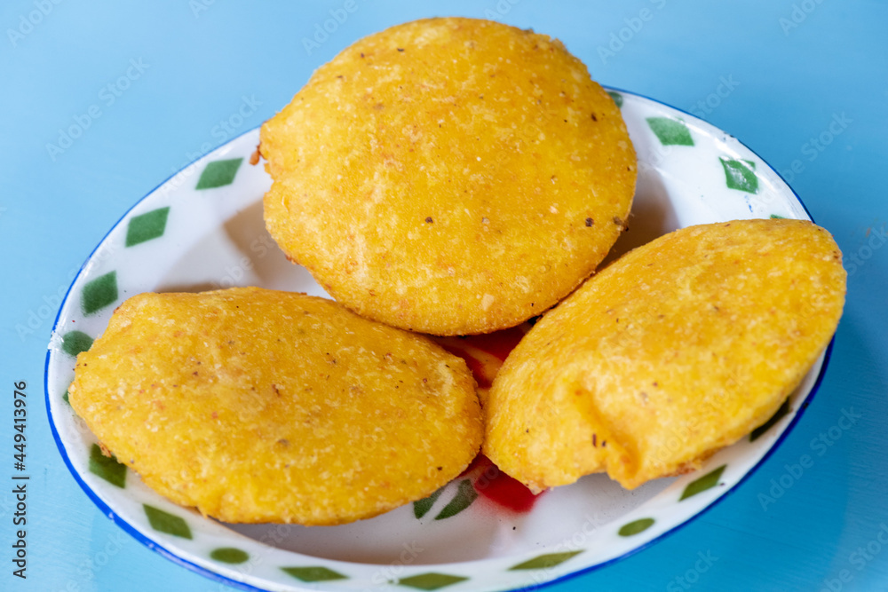 Egg arepa on blue background. typical coastal food. Colombia Stock ...