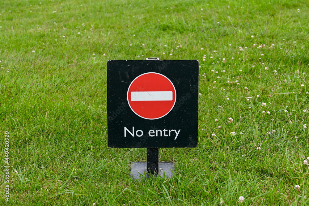 No entry sign standing on grass. No people. Copy space. Stock Photo ...
