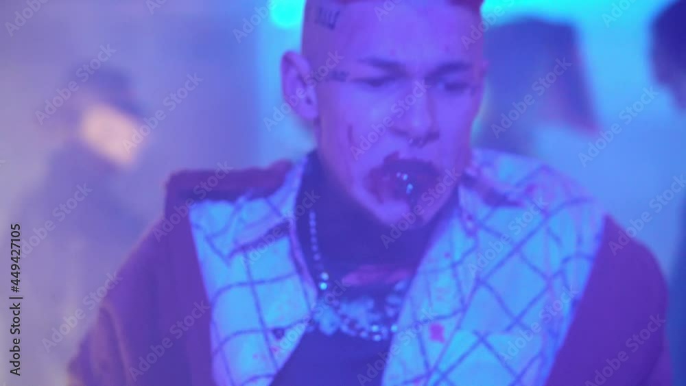 Cyberpunk future concept. Strange character with punk-type haircut is ...