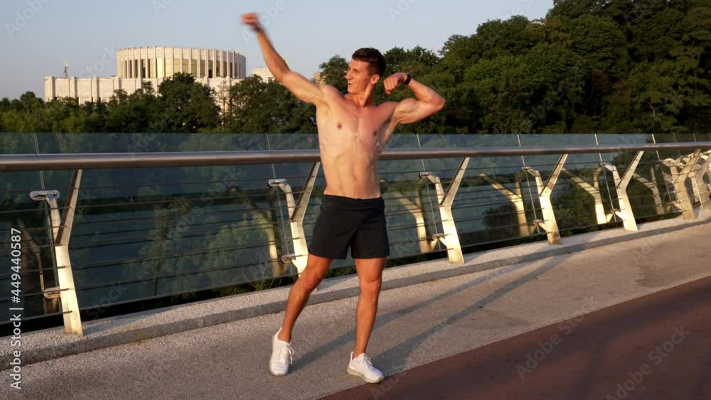 muscular man showing off posing like bodybuilder outdoor, bodybuilding ...