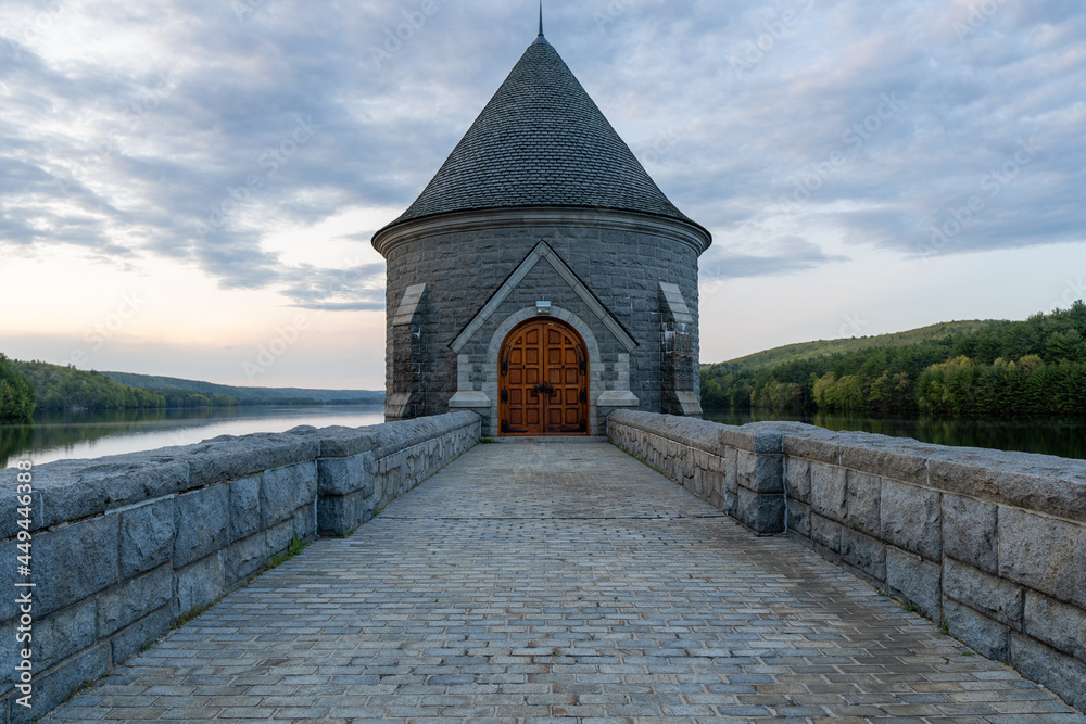 Stone bridge leads to tower. Wooden door. Saville Dam. Stock Photo ...