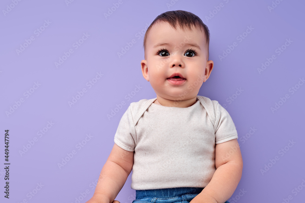 Cute Baby child with sweet cute facial expression posing at camera ...