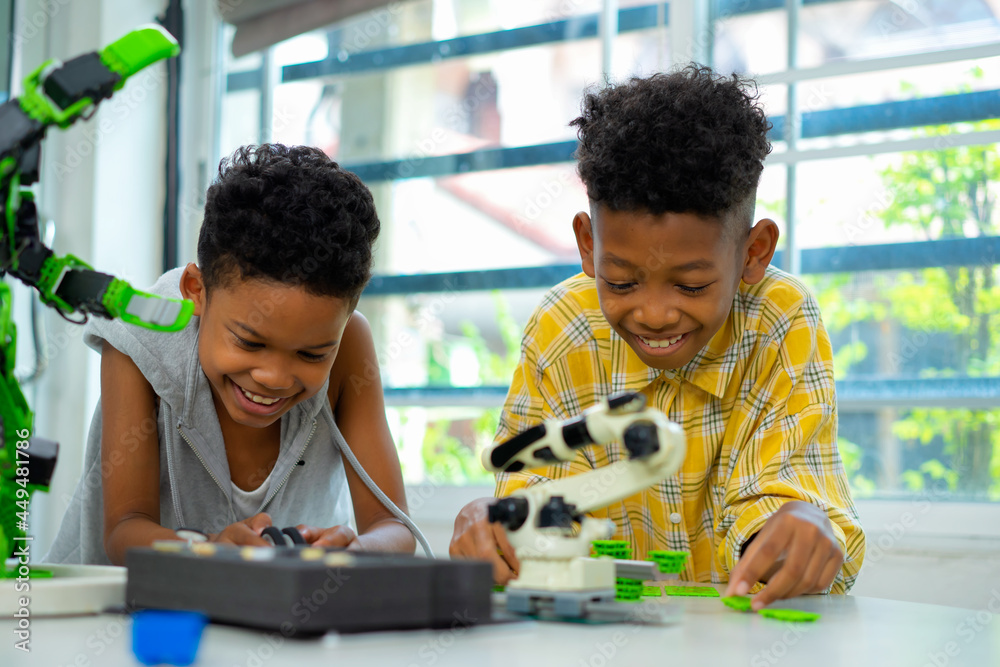 African american boy are setting robot kit in classroom. Stock Photo ...
