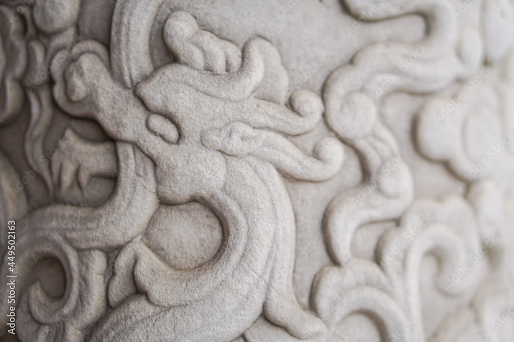 The stone is carved into a dragon,A wall with dragon stone sculpture ...