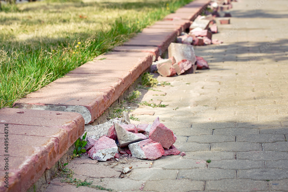 Road work, curb replacement, urban landscape edging. Broken sidewalk ...