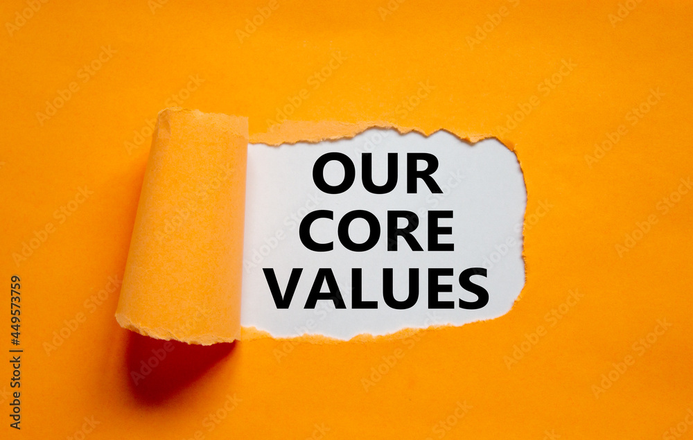 Our core values symbol. Words 'Our core values' appearing behind torn ...