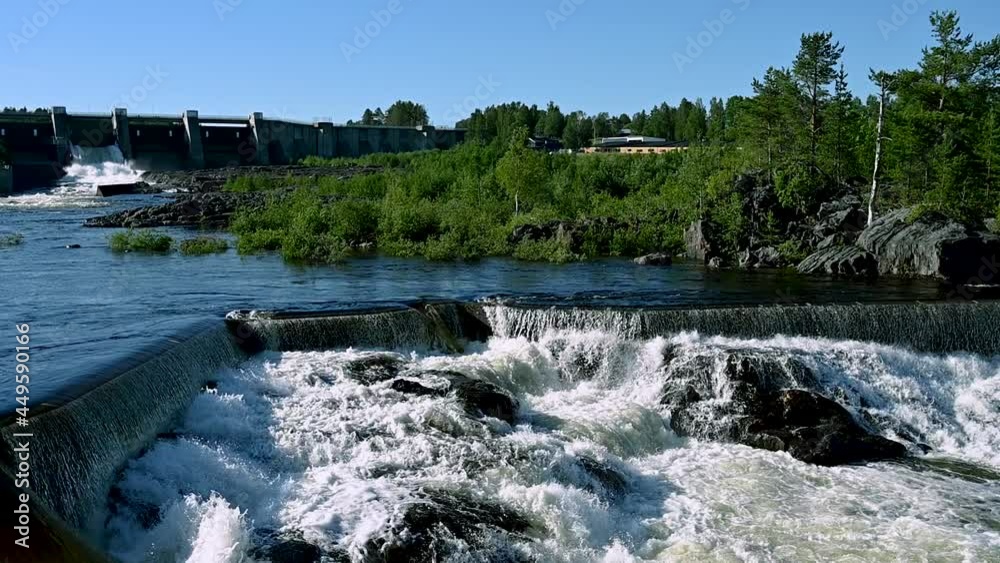 Hydroelectric dam with flowing water. Fairy waterfall at wild forest ...