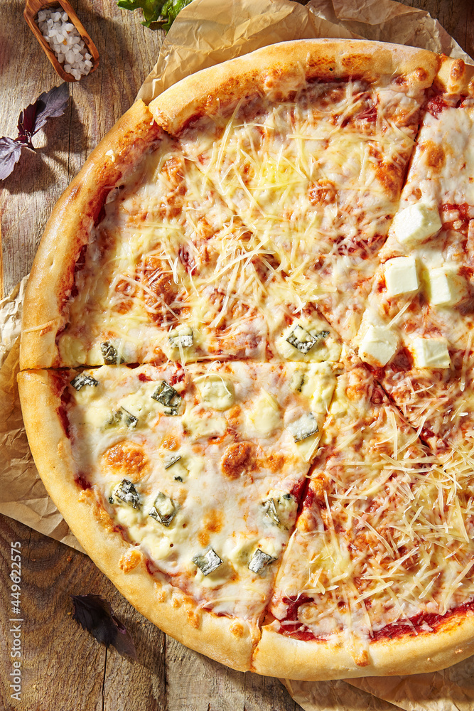 Four Cheese Pizza or Quattro Formaggi Pizza topped with tomato sauce, mozzarella, gorgonzola ...