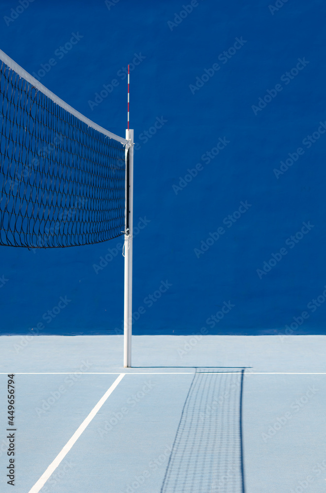 Blue sports playground. A place to play volleyball. Focus on the ...