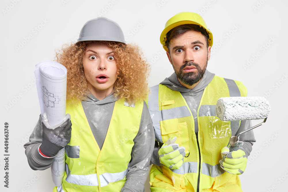 Stunned woman architect and man decorator come on construction site ...