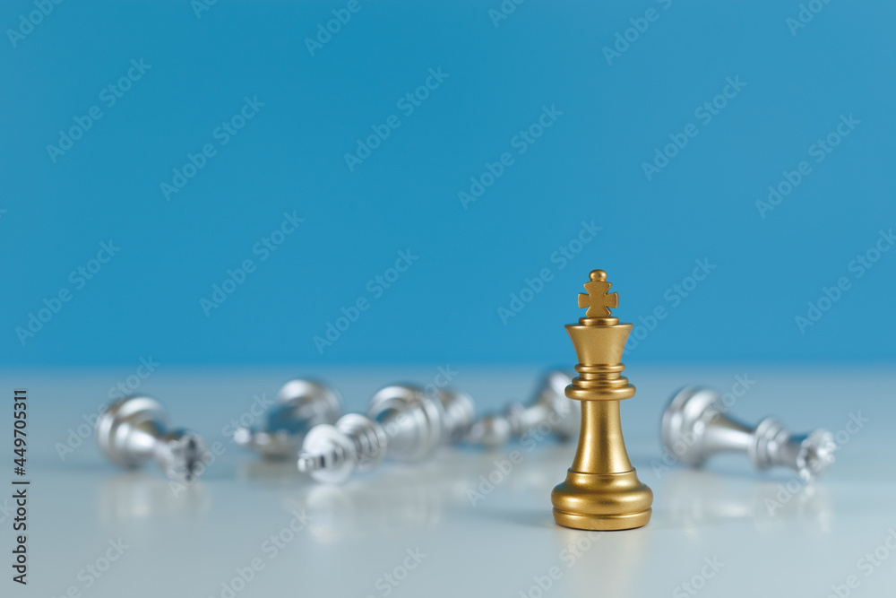 Chess game gold king standing confront the silver team. blue background ...