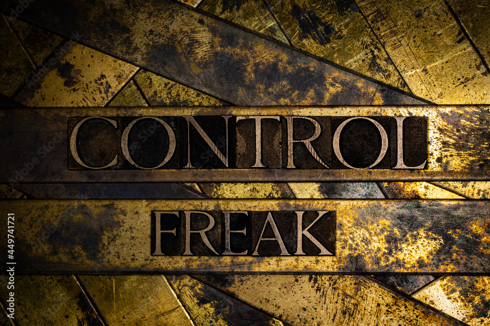 Control Freak text on vintage textured copper and gold background Stock ...
