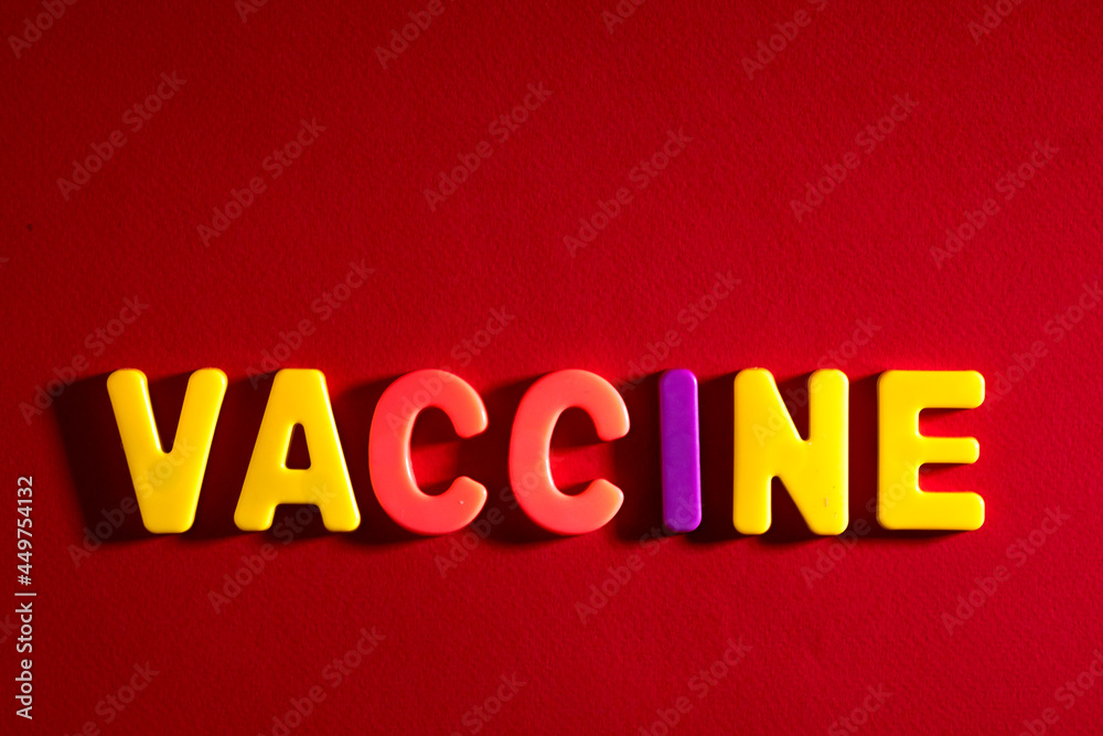 Completing vaccine words. Vaccine word made from colourful plastic baby ...