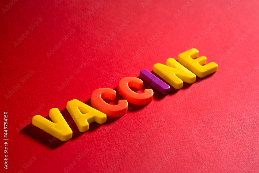Completing vaccine words. Vaccine word made from colourful plastic baby ...
