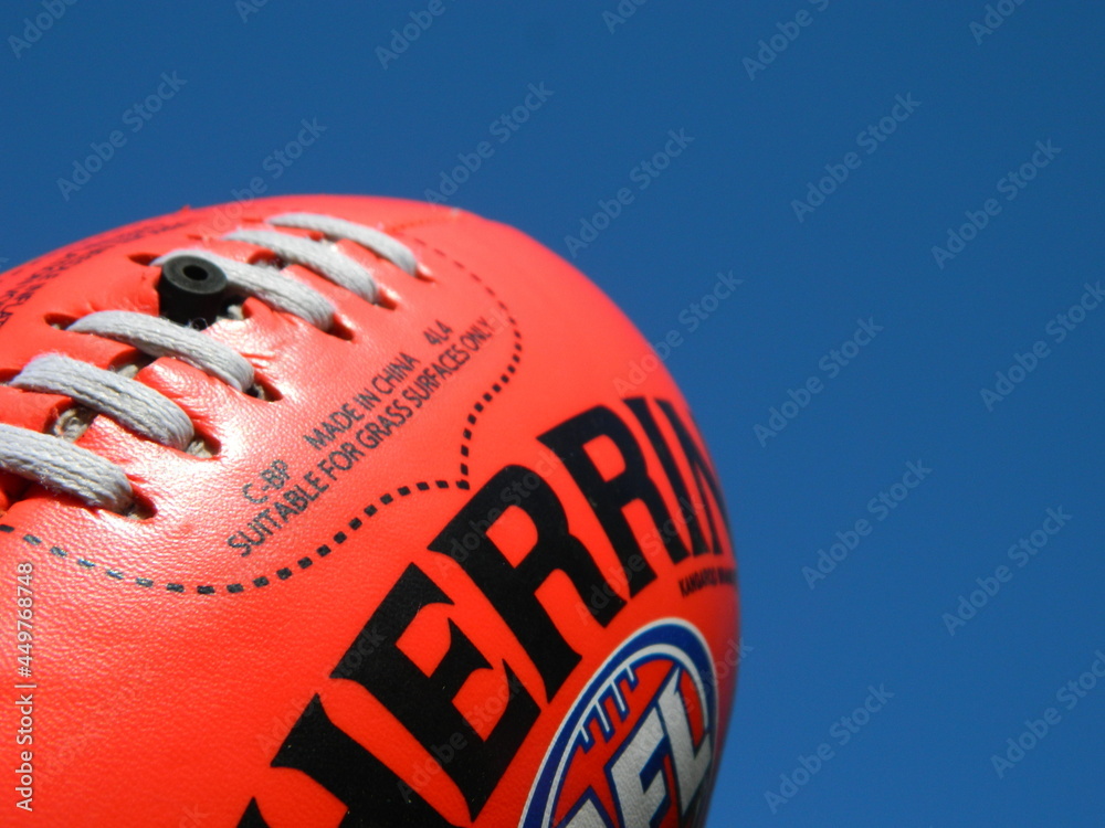 Close up of an AFL football on a blue sky background Stock Photo ...