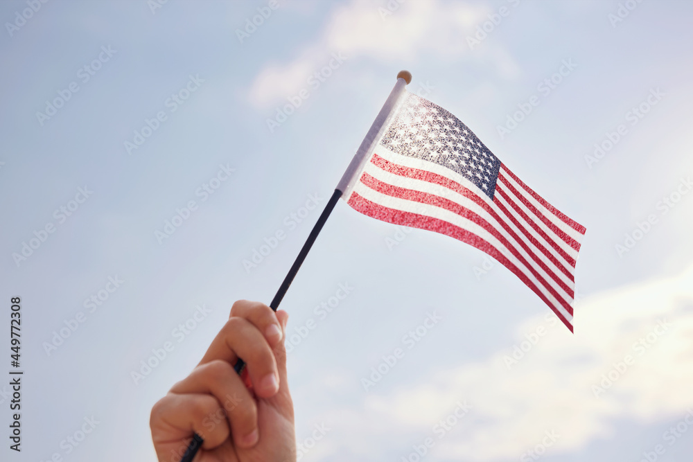 Hand holding American Flag Stock Photo | Adobe Stock