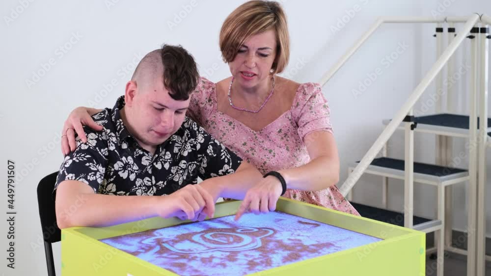 Children with disability getting sensory activity Sand tray, sand table ...