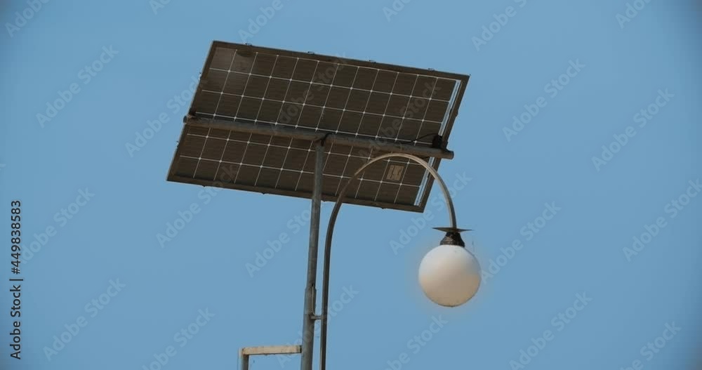 Solar battery on a lamppost. Renewable, clean energy source. Street ...