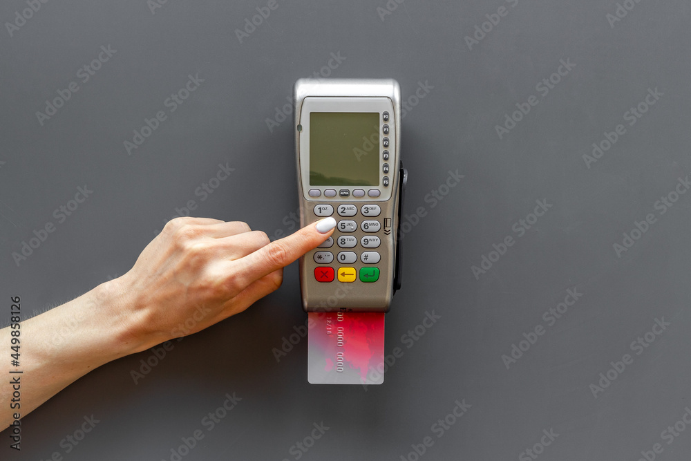 Hand swiping credit card by pos terminal. Payment transactions concept ...
