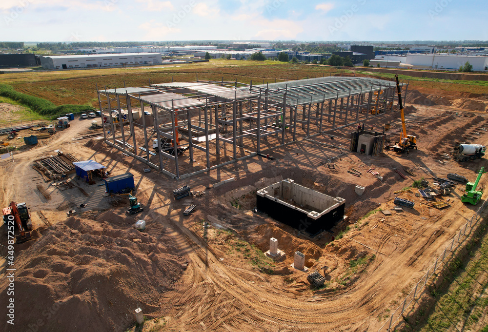 Construction of warehouse from metal structures. Industrial building on ...